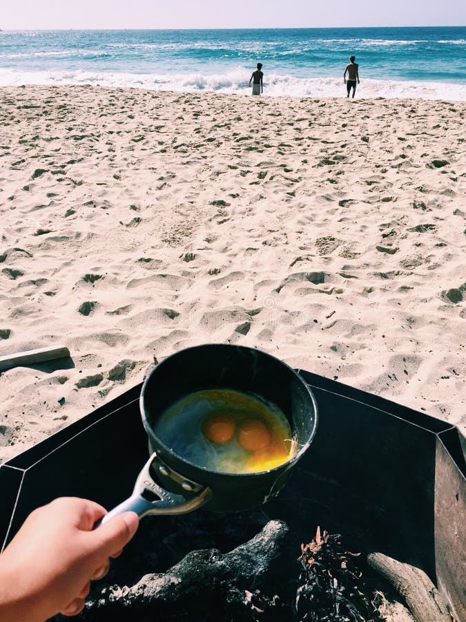 Cooking eggs on the beach stock image. Image of water - 144868325