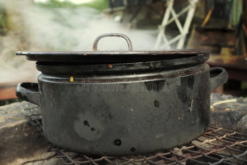 Cooking on fire stock image. Image of boiling, steam - 19960633