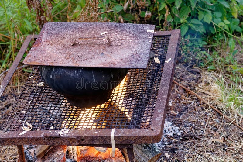 Cooking on a Fire in Cast Iron Stock Image - Image of heat, food: 283868285