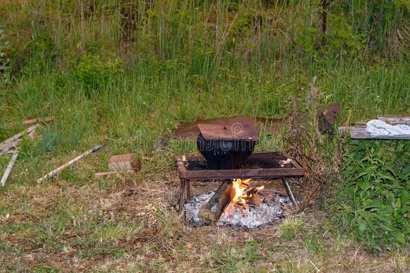 Cooking on a Fire in Cast Iron Stock Photo - Image of cook, stove ...