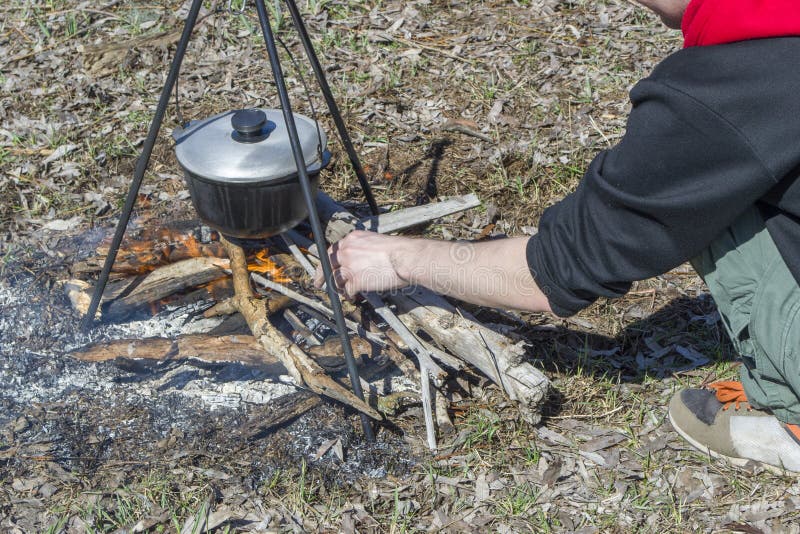 Cooking on a Fire at Spring. Close View of Caldron Over the Campfire ...