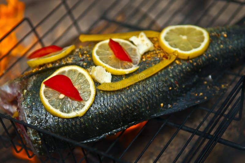 Cooking Fish Over Open Fire Stock Photo - Image of bass, freshwater ...