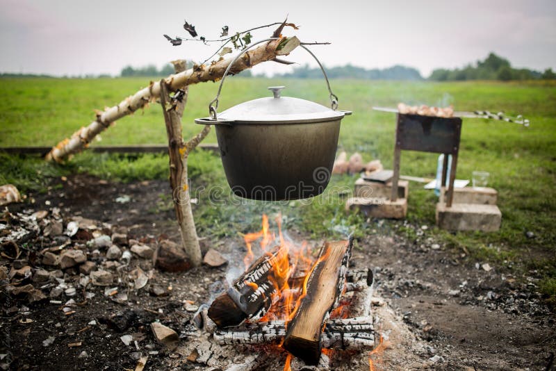 A Cooking Fish Soup in Pot on Bonfire Stock Image - Image of fire ...