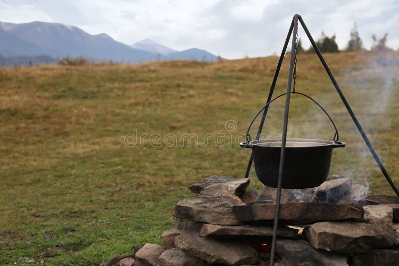Cooking Food on Campfire in Mountains. Camping Season Stock Image ...