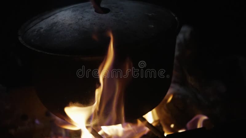 Open Cauldron with Food Cooked Over a Fire Stock Footage - Video of ...