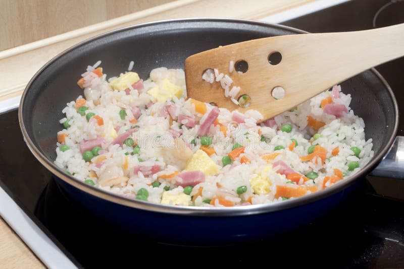 Cooking fried rice stock image. Image of spoon, delight - 27051347
