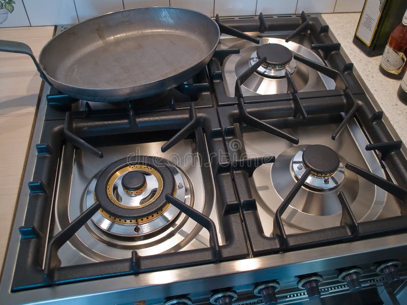 Cooking on a gas stove stock photo. Image of meal, chef - 16322638