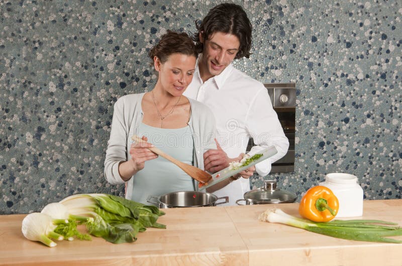 Woman Cooking Man with House Model Stock Image - Image of happiness ...
