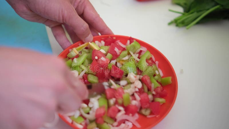 Cooking at Home. Man Mixing Chopped Vegetables in Red Plate with Knife ...