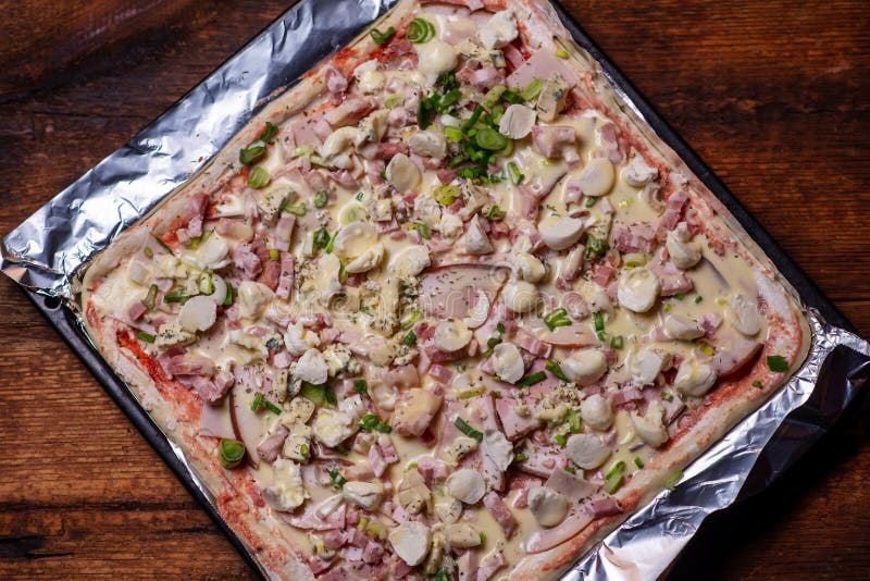 Cooking Homemade Pizza on a Baking Sheet. Pizza with Mozzarella Cheese ...