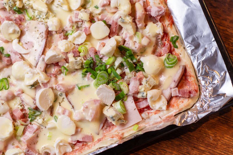 Cooking Homemade Pizza on a Baking Sheet. Pizza with Mozzarella Cheese ...