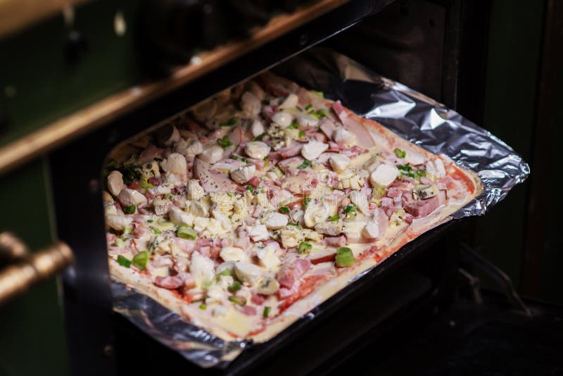 Cooking Homemade Pizza on a Baking Sheet in the Oven. Pizza with ...