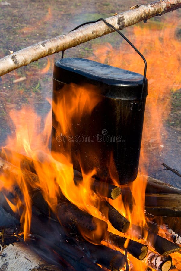 Cooking in a Kettle on a Fire. Stock Image - Image of environment, pots ...
