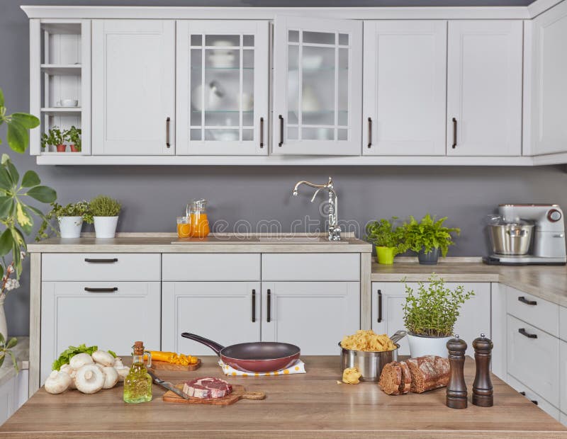 Cooking in the kitchen stock photo. Image of appliance - 127504934