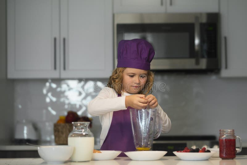 Cooking in Kitchen. Funny Child Stand at Kitchen Table Have Fun Baking ...