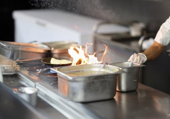 Cooking in the Kitchen in Restaurant on Fire Stock Image - Image of ...