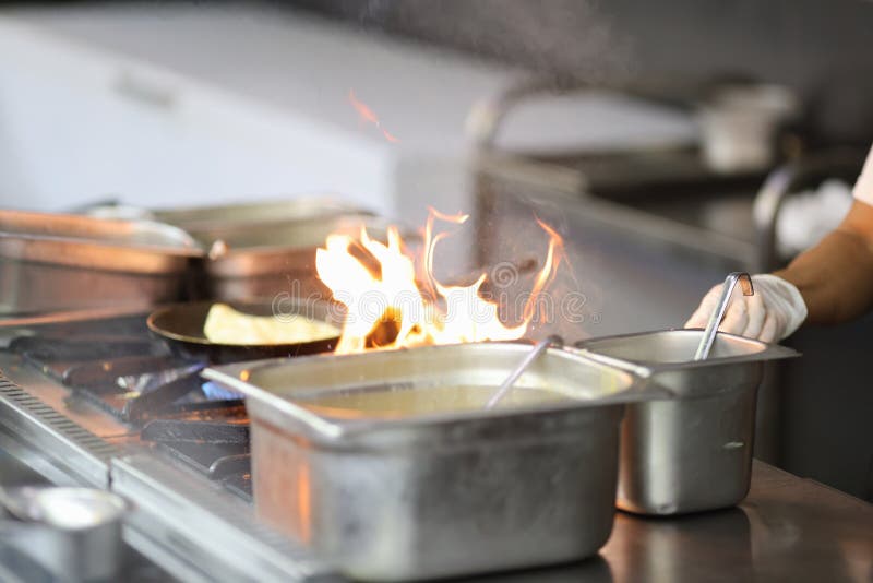 Cooking in the Kitchen in Restaurant on Fire Stock Image - Image of ...