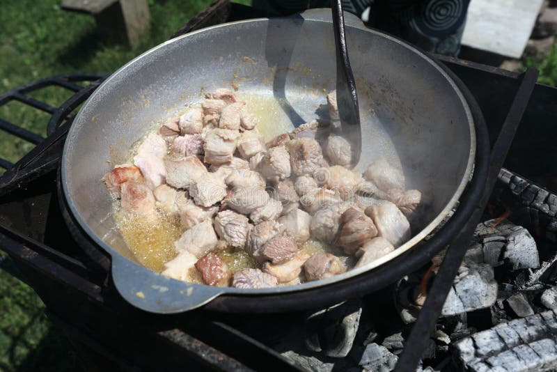 Cooking Lamb Meat in Cauldron Stock Photo - Image of cooking, mutton ...