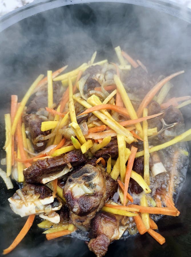 Cooking Lamb Pilaf in a Cauldron Over a Fire Stock Photo - Image of ...