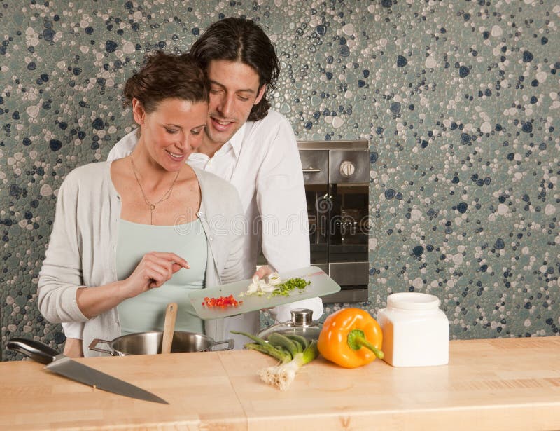 Woman Cooking Man with House Model Stock Image - Image of happiness ...