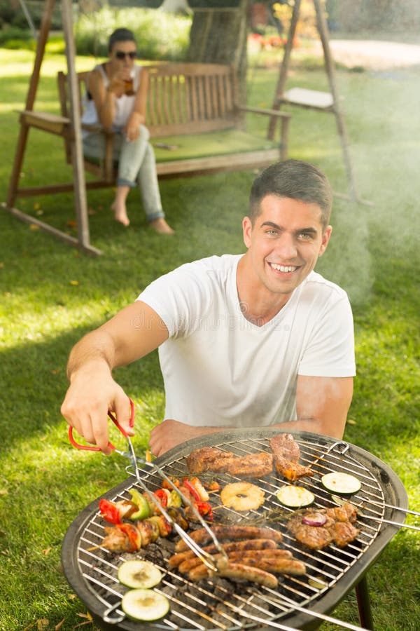Cooking man and barbecue stock image. Image of picnic - 71314141