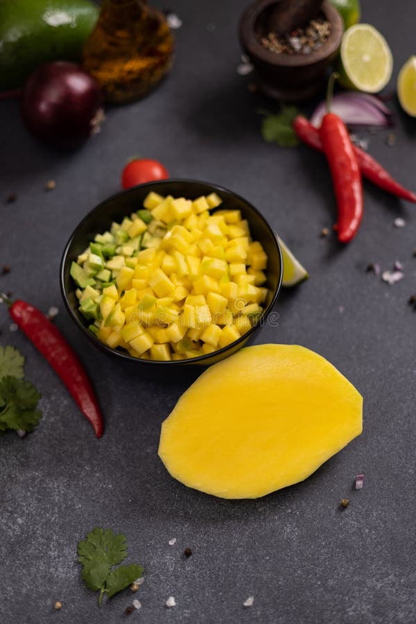 Cooking Mango Salsa - Sliced Chopped Ingredients in a Black Ceramic ...