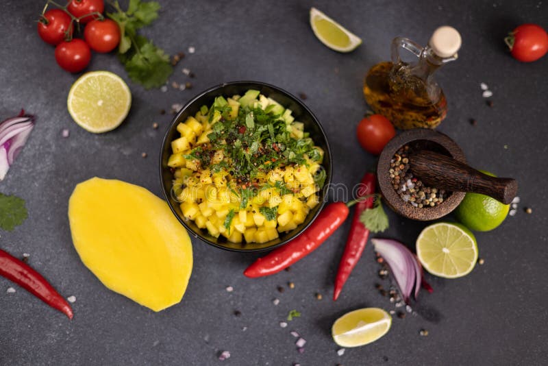 Cooking Mango Salsa - Sliced Chopped Ingredients in a Black Ceramic ...