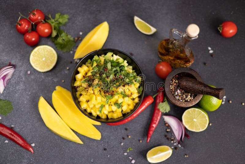 Cooking Mango Salsa - Sliced Chopped Ingredients in a Black Ceramic ...