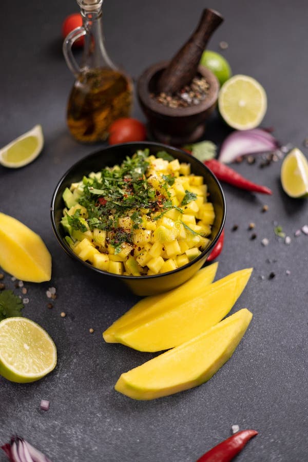Cooking Mango Salsa - Sliced Chopped Ingredients in a Black Ceramic ...