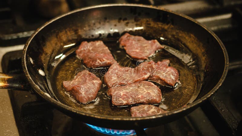 Cooking Meat in Butter on the Stove Stock Photo - Image of cooking ...