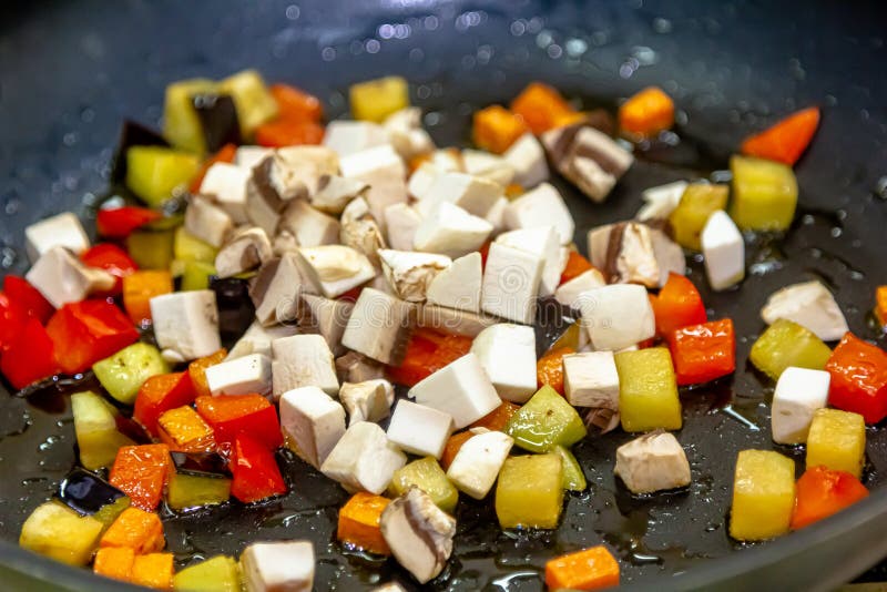 Cooking Meat Cut into Small Pieces in a Frying Pan with Vegetables ...