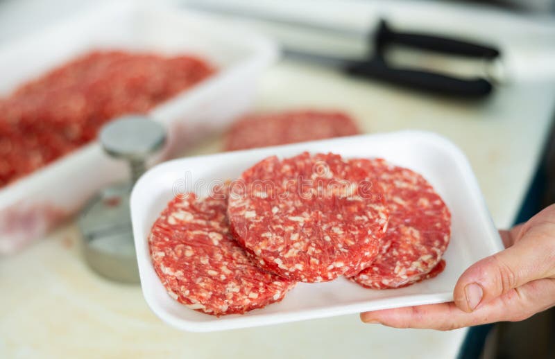 Cooking Meat Cutlets in Kitchen Using Special Devices Stock Photo ...
