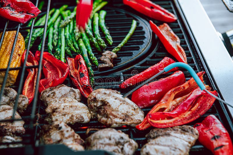 Cooking of Meat and Vegetables on a Grill or on Barbeque with ...