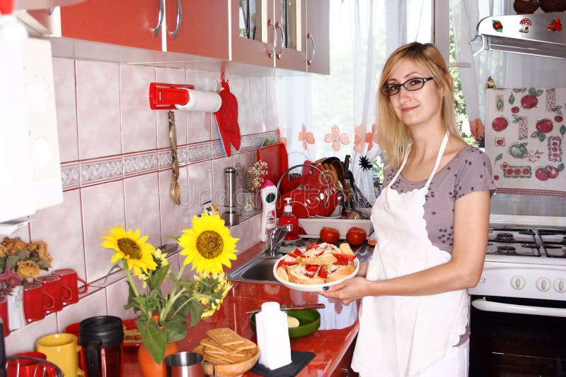 Cooking in a Modern Kitchen Stock Photo - Image of plate, vase: 76775976