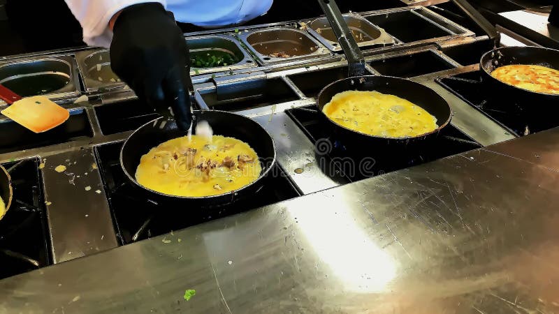 Cooking Omelettes and Fried Eggs. Breakfast Buffet in Restaurant Stock ...