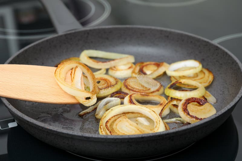 Cooking Onion Rings in Frying Pan, Closeup Stock Photo - Image of ...