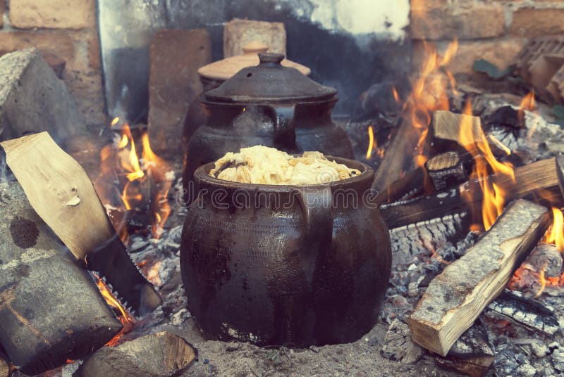 Cooking on an open fire stock image. Image of bonfire - 34837883