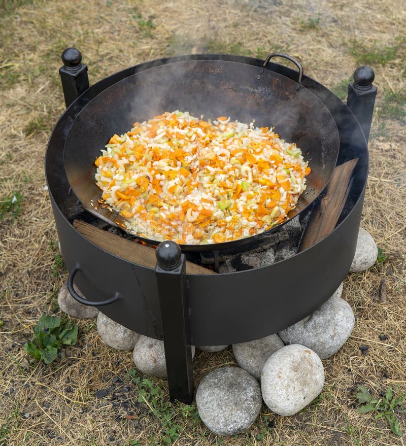 Cooking on an open fire. stock photo. Image of healthy - 173929268