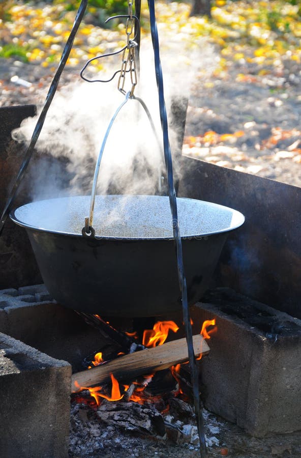 Cooking Outdoors in Cast-iron Cauldron Stock Image - Image of cooking ...