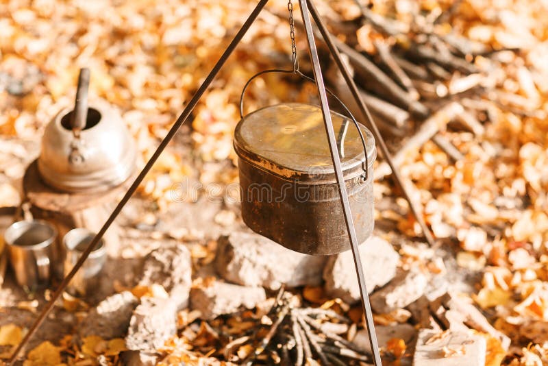 Cooking Over a Campfire in a Cast Iron Pot. Cast Iron Pot for Soup ...