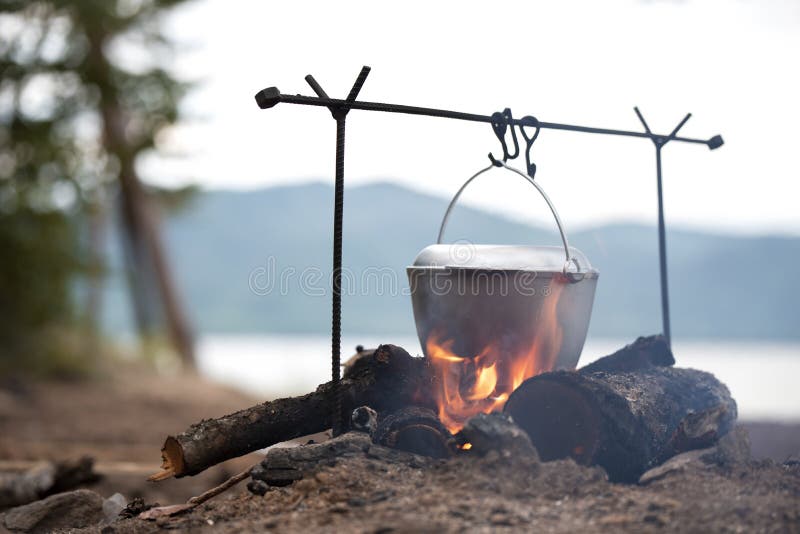 Cooking Over a Fire in a Pot Stock Photo - Image of fire, adventure ...