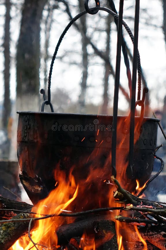 Cooking Over Fire in the Woods in Winter. Stock Image - Image of fire ...
