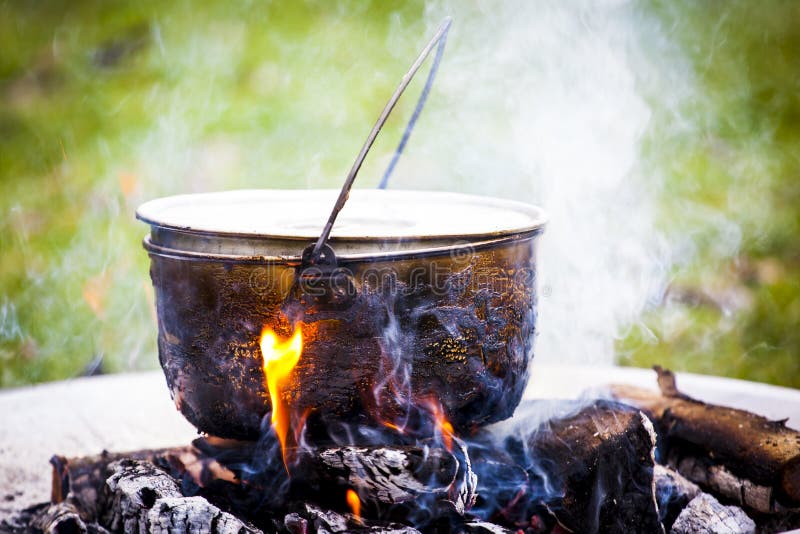 Cooking Over Open Fire Outdoors in the Forest Stock Photo - Image of ...