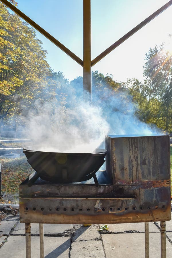 Cooking Over an Open Fire. Soup in a Cauldron on the Grill on the Fire ...