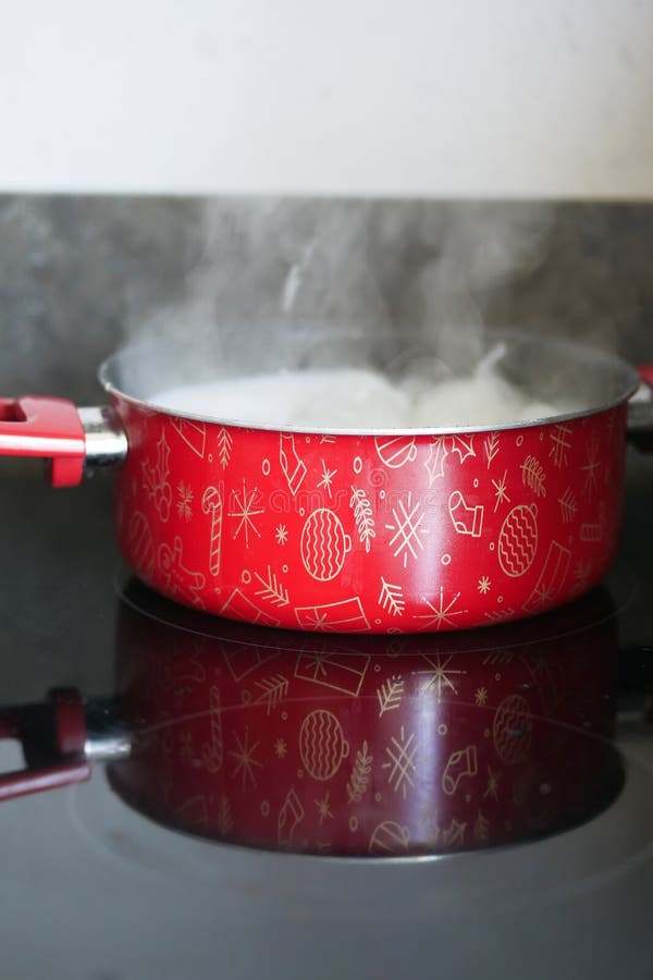 Cooking Pan on Electric Stove, Electric Stove is Heated To Red. Stock ...