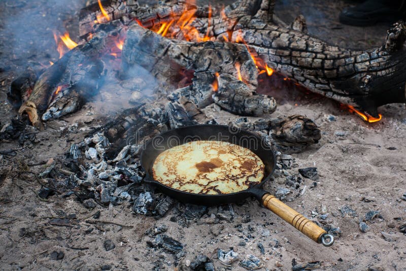 Cooking Pancakes on the Fire in the Forest. Stock Photo - Image of ...