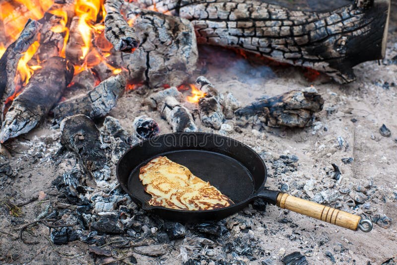 Cooking Pancakes on the Fire in the Forest. Stock Photo - Image of ...