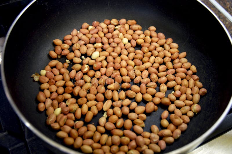 Cooking Peanuts in a Black Pan Stock Photo - Image of diet, nutrition ...