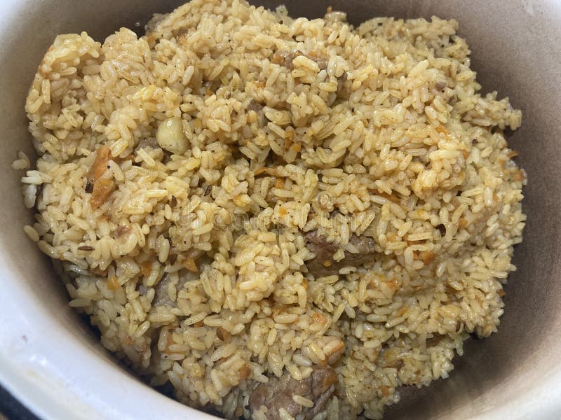 Cooking Pilaf Rice with Meat, Vegetables and Spices Stock Photo - Image ...