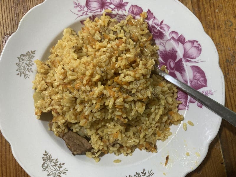 Cooking Pilaf Rice with Meat, Vegetables and Spices Stock Photo - Image ...